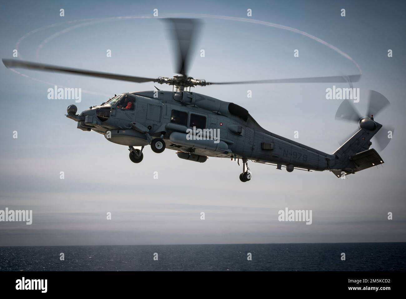 Danish MH-60R Seahawk helicopter flying from the Greenland Patrol Ship ...