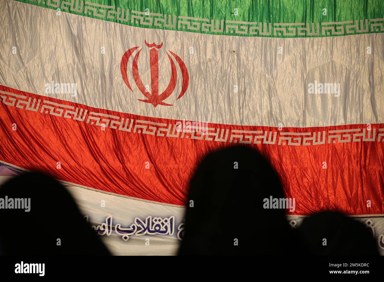 Tehran, Tehran, Iran. 29th Dec, 2022. Three veiled women stand in front ...