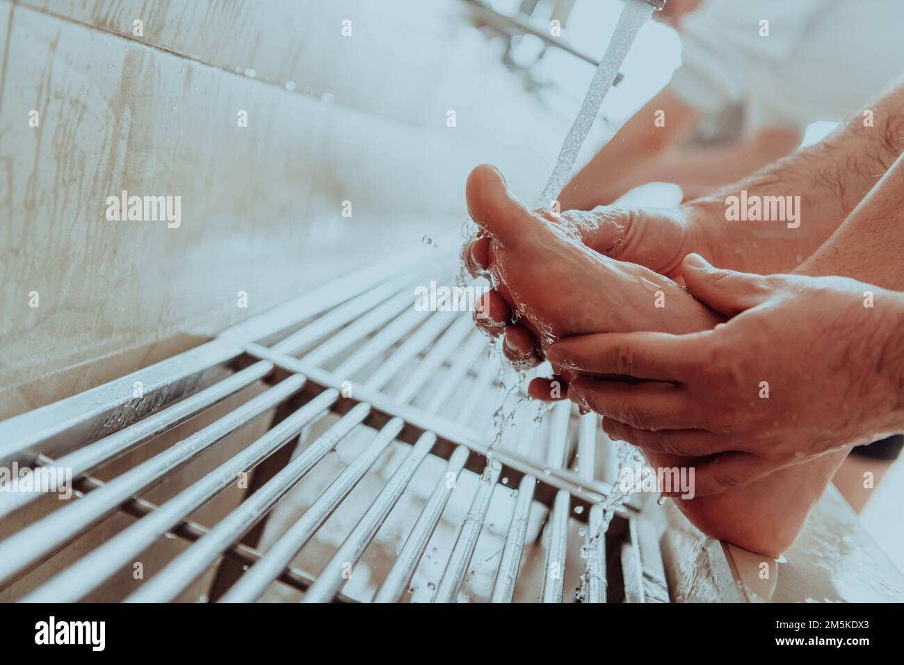A Muslim performing ablution. Ritual religious cleansing of Muslims ...