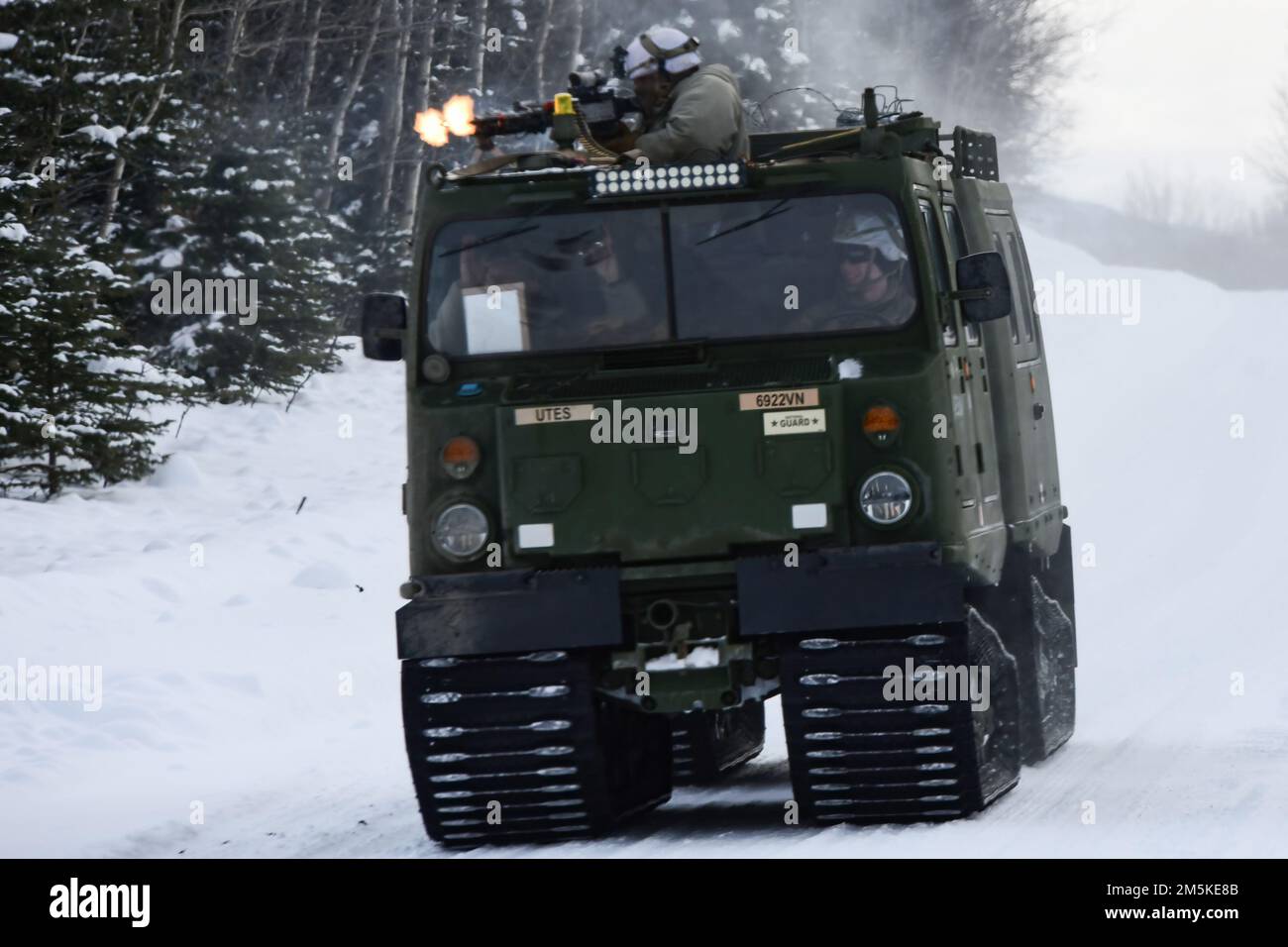 Opposing forces soldiers use a small-unit support vehicle to attack ...