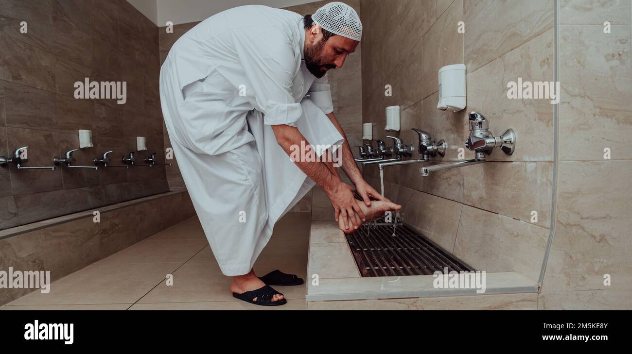 A Muslim performing ablution. Ritual religious cleansing of Muslims ...