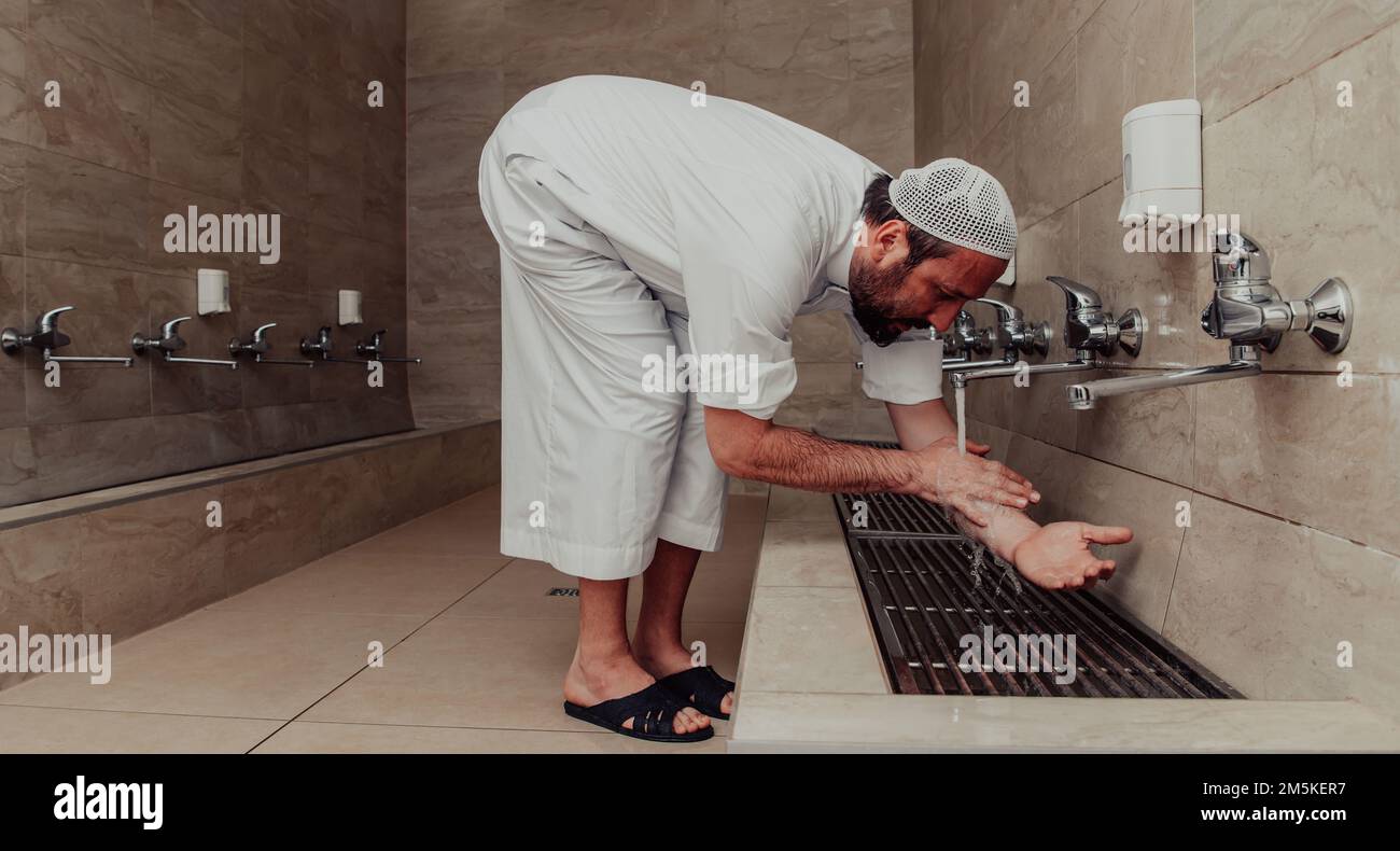 A Muslim performing ablution. Ritual religious cleansing of Muslims ...
