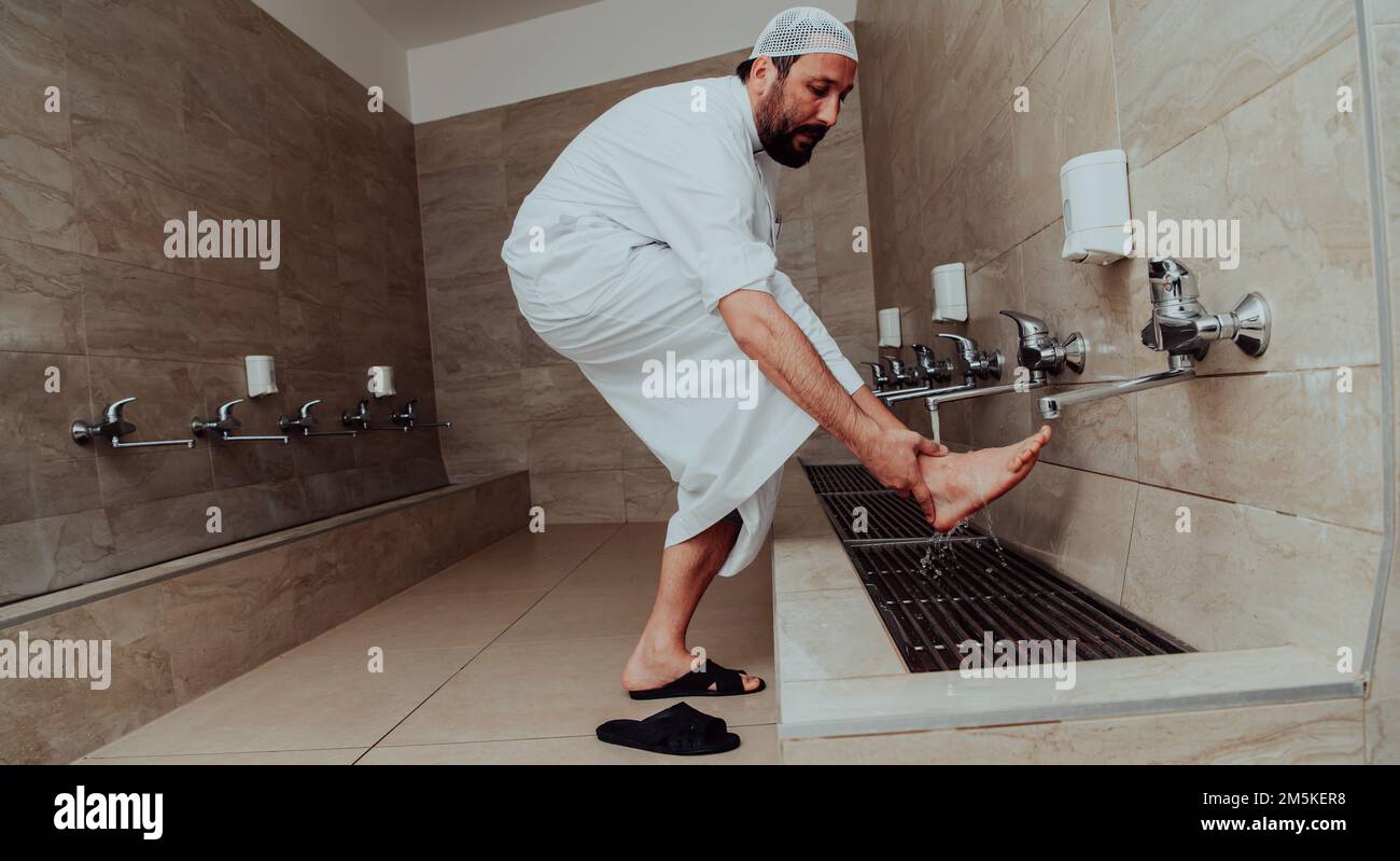 A Muslim performing ablution. Ritual religious cleansing of Muslims ...