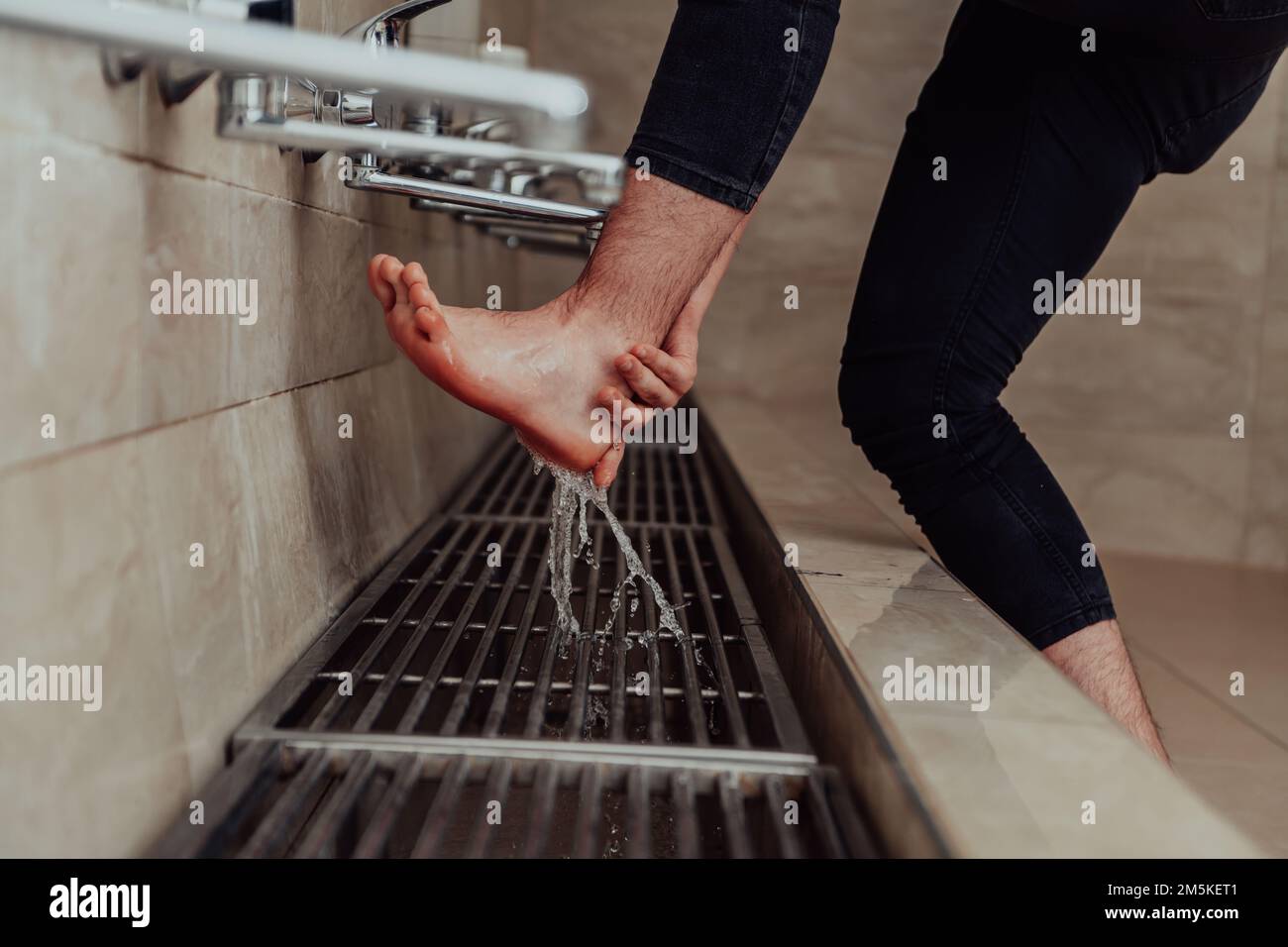A Muslim performing ablution. Ritual religious cleansing of Muslims ...