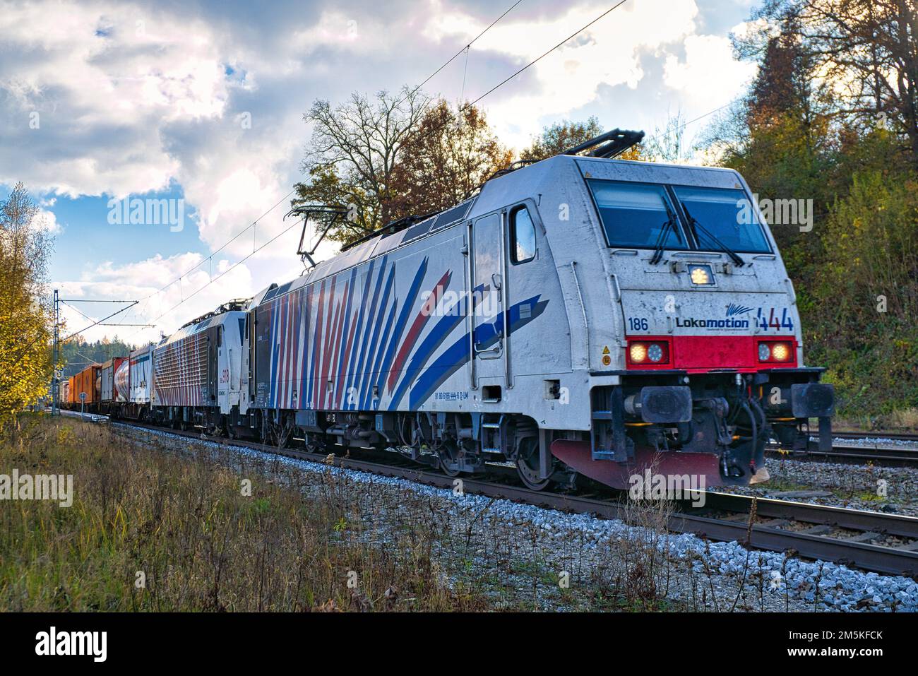 A modern freight train passing through Assling Stock Photo - Alamy