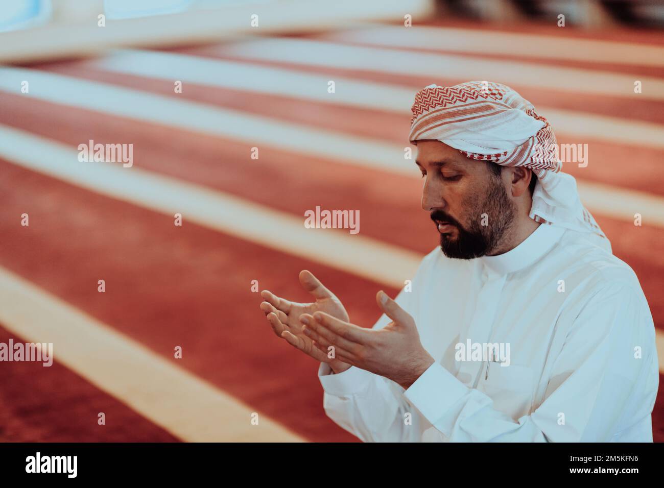Muslim Arabic man praying. Religious muslim man praying inside the ...