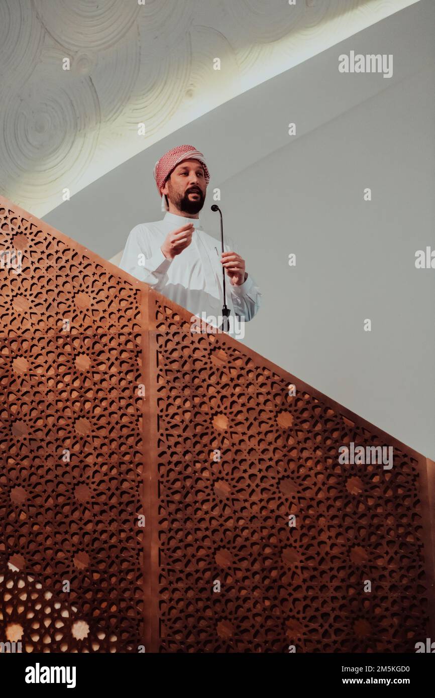 Muslims arabic Imam has a speech on friday afternoon prayer in mosque ...