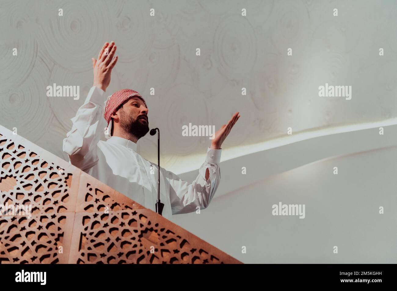 Muslims arabic Imam has a speech on friday afternoon prayer in mosque ...