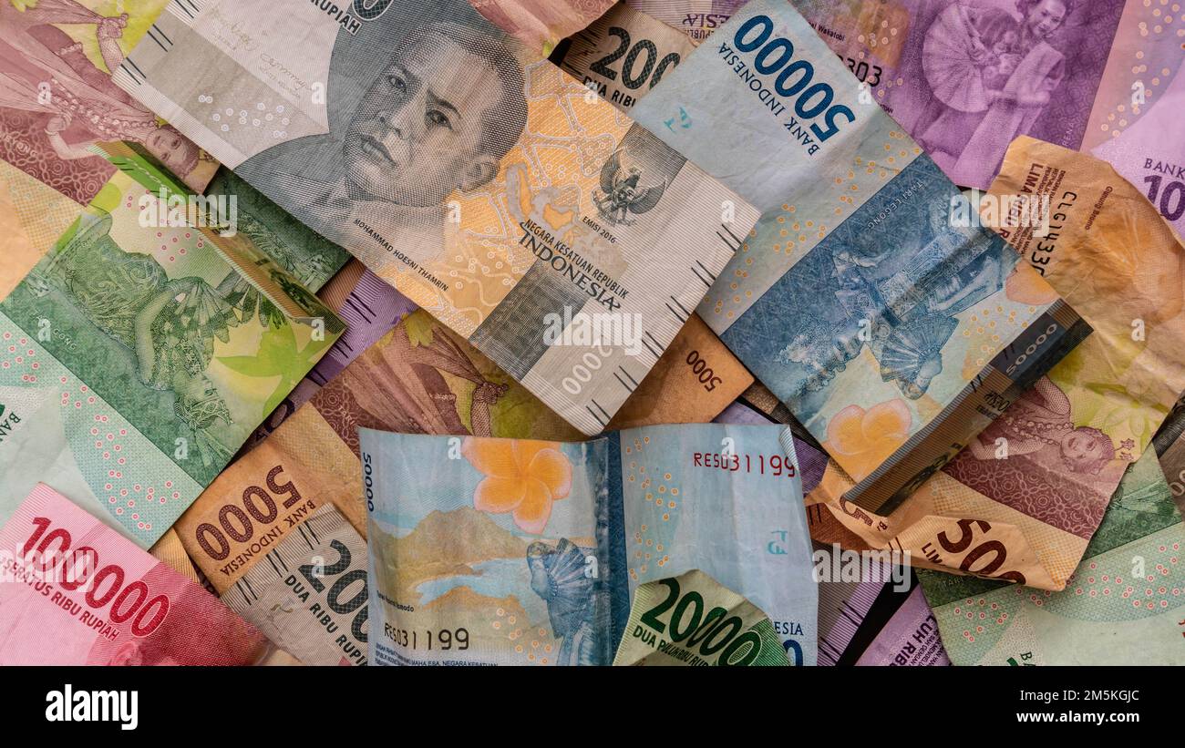 pile of rupiah banknotes as background Stock Photo - Alamy
