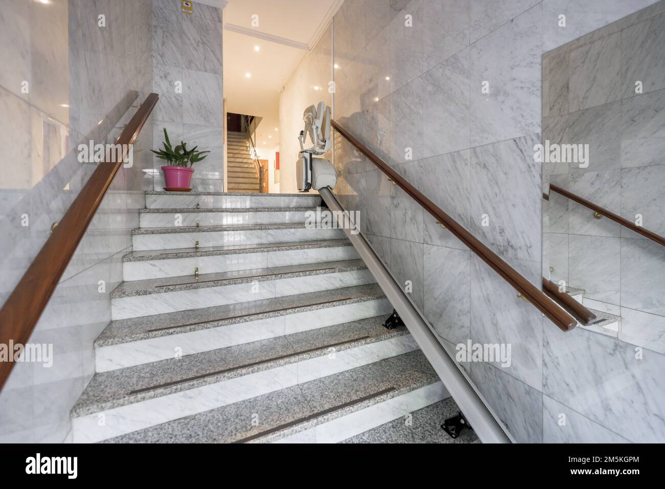 White marble stairs of a corridor of a tenement building with electric ...