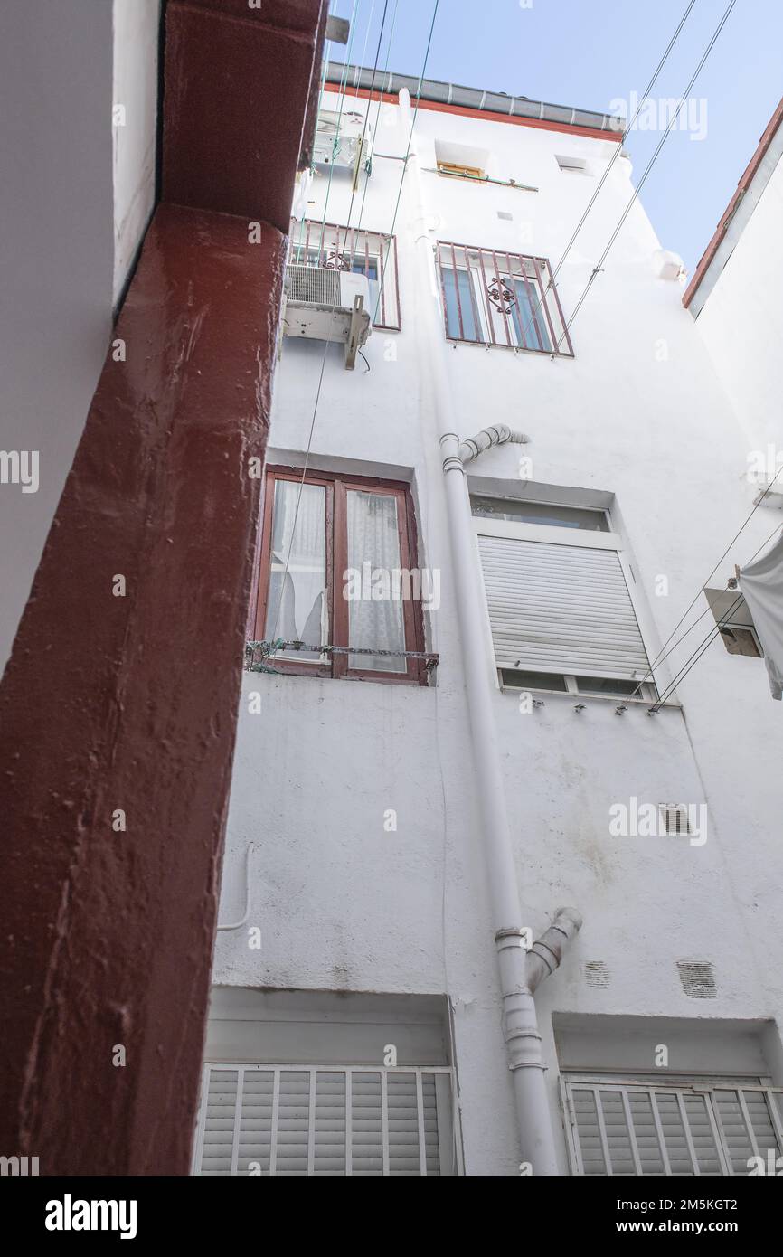 Facade of a building with balconies with black metal wrought iron ...