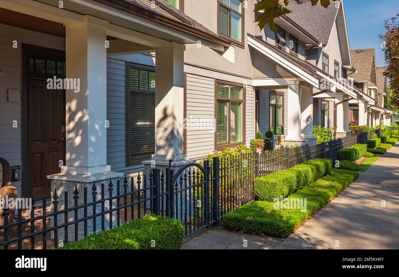 Houses in suburb at summer in the north America. Luxury houses with ...