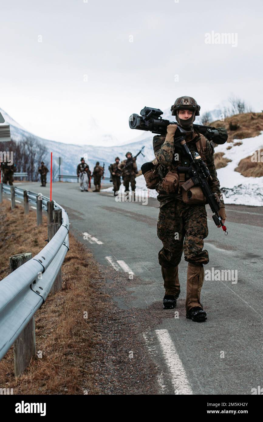 U.S. Marine Corps Lance Cpl. Jacob Smith carries an M3E1 Multi-purpose ...