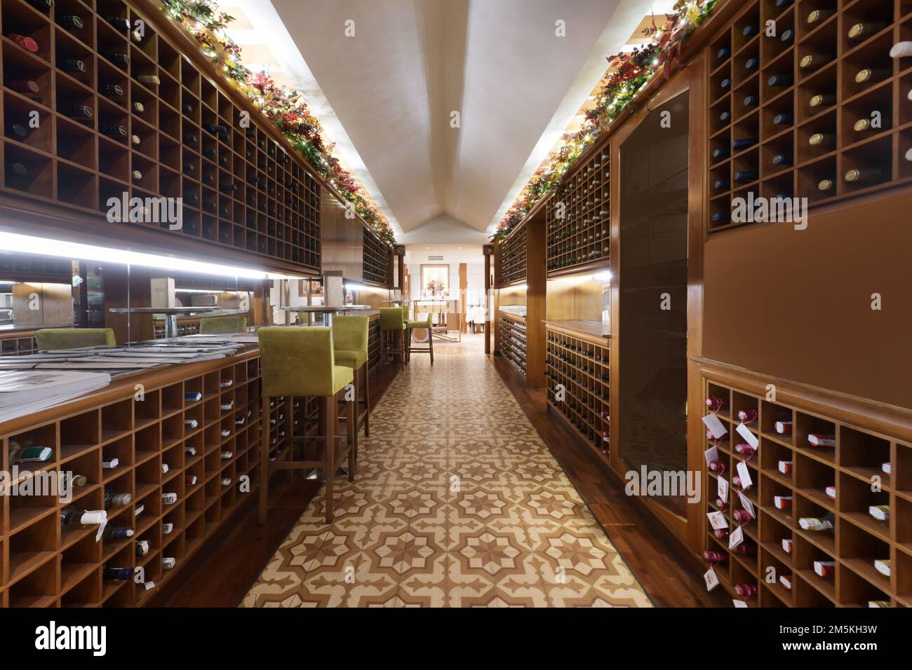 Cellar of a restaurant with wooden shelves to keep the bottles ...