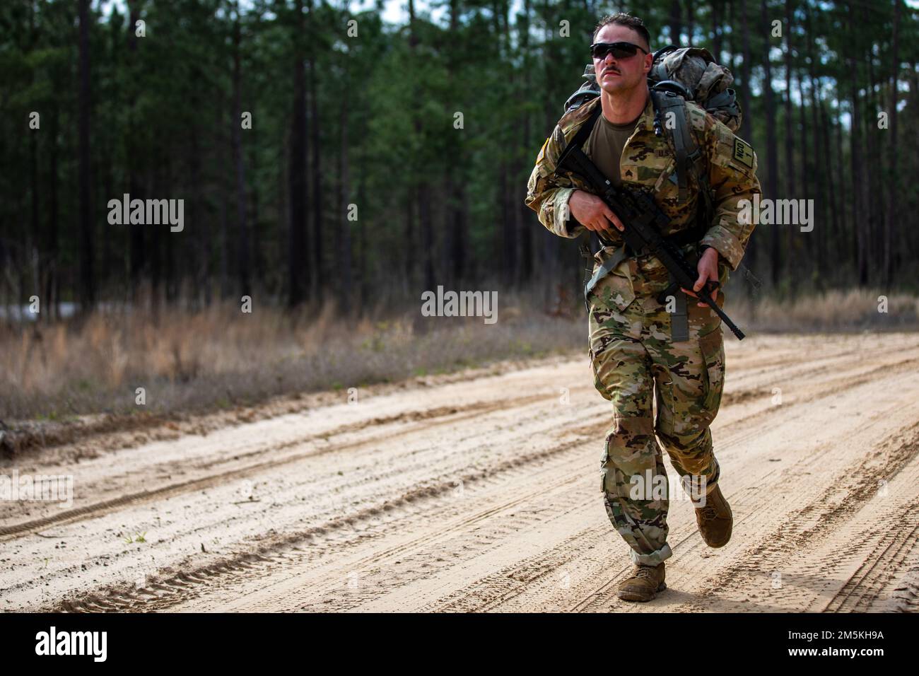 U.S Army Sgt. Matthew Fiore, a UH-60 Black Hawk crew chief representing ...