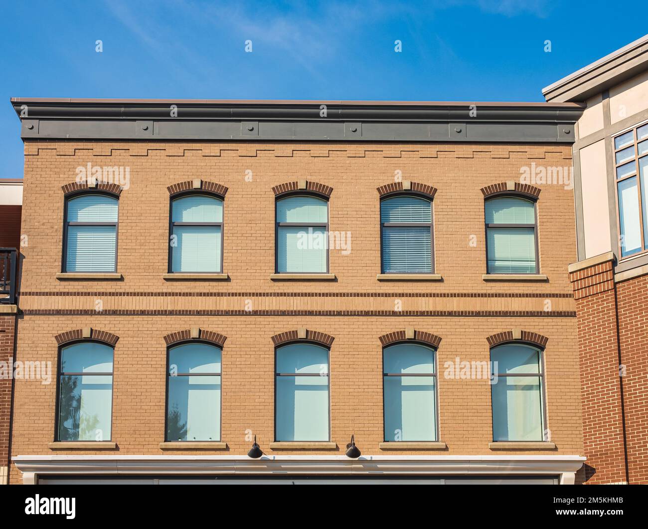 Beautiful view of building with arched windows. Windows with shutters ...