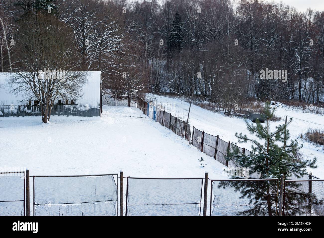 Military warehouse hangar located on a territory closed by a fence in ...
