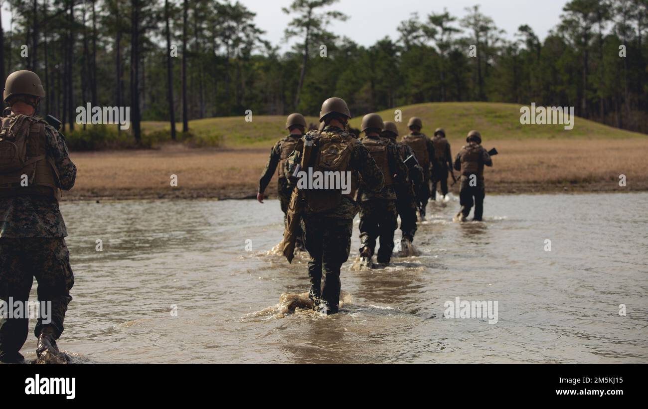 U.S. Marines with Marine Corps Engineer School, make their way through ...