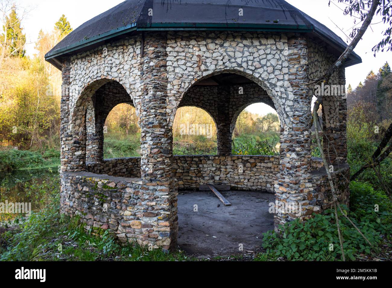 Park rotunda built of flint and limestone cobblestones with columns and ...