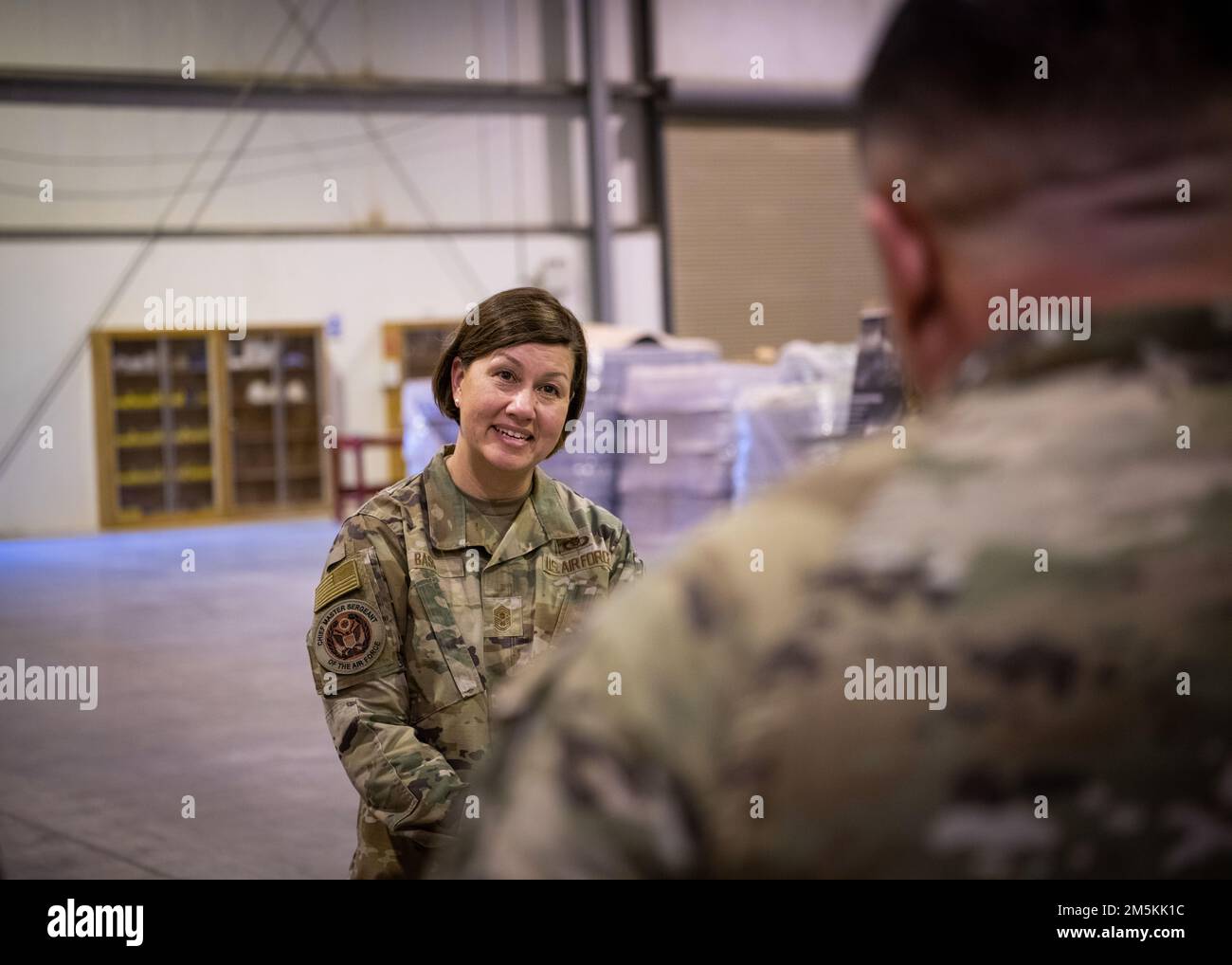 Chief Master Sgt. of the Air Force JoAnne S. Bass speaks to an Airman ...