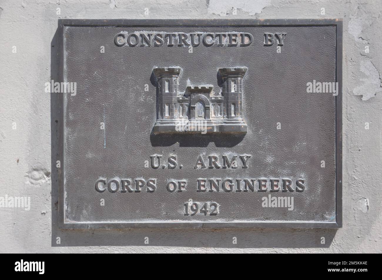 A dedication plaque is displayed at the entrance to the interior of ...