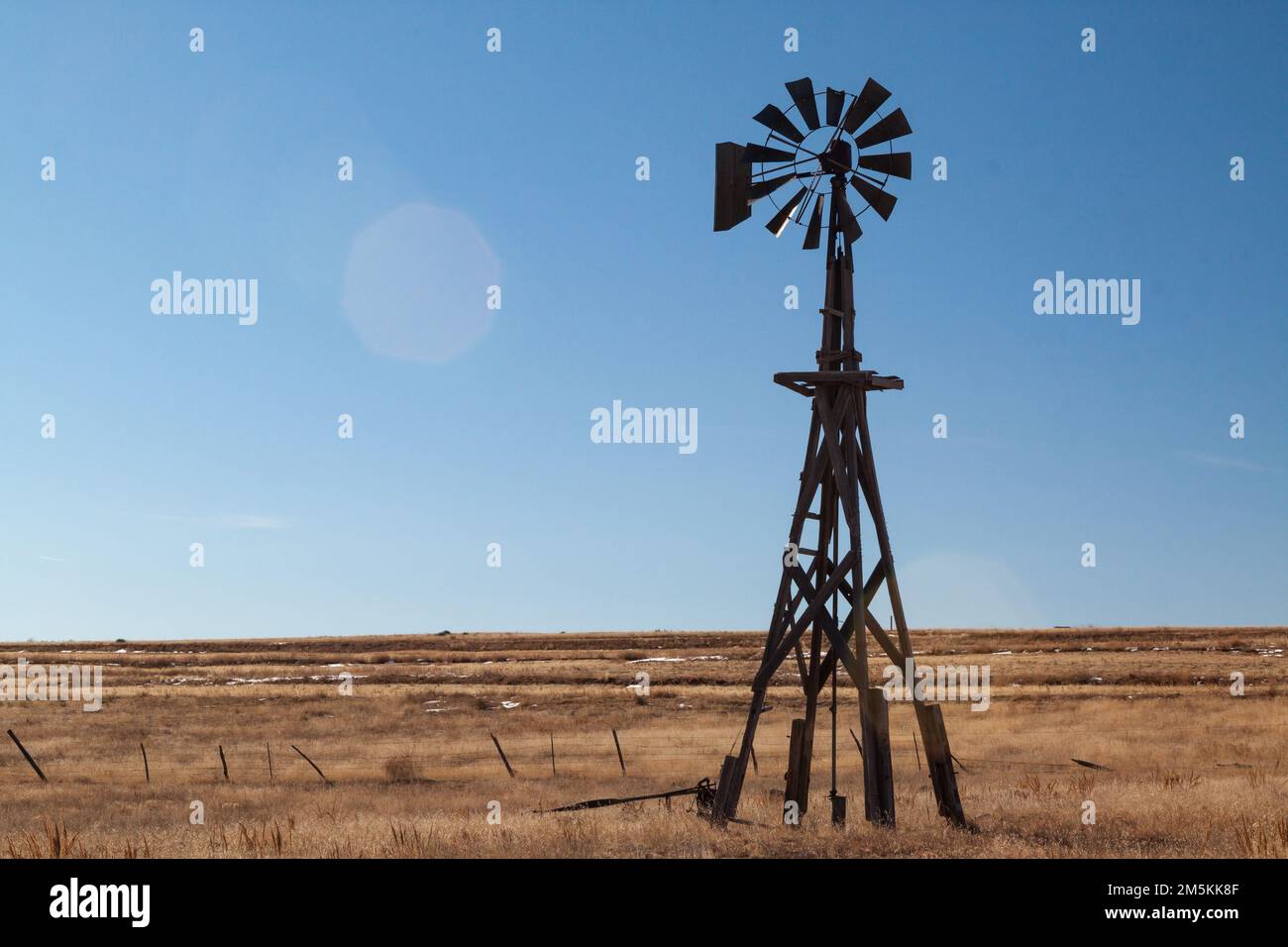 Old, broken windmill on the prairie in Colorado. Concept alone ...