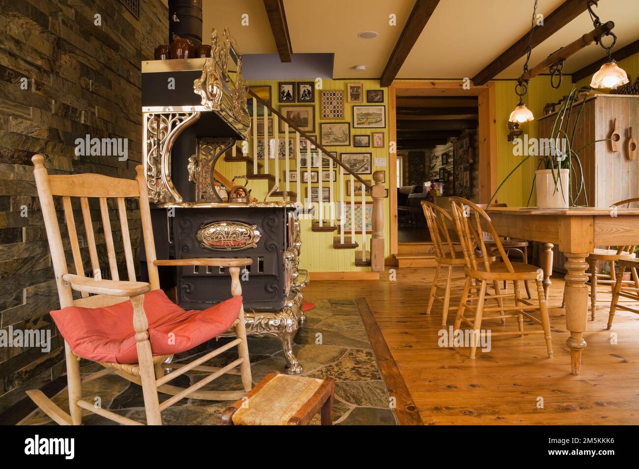 Old wooden rocking chair next to antique Royal model wood burning ...