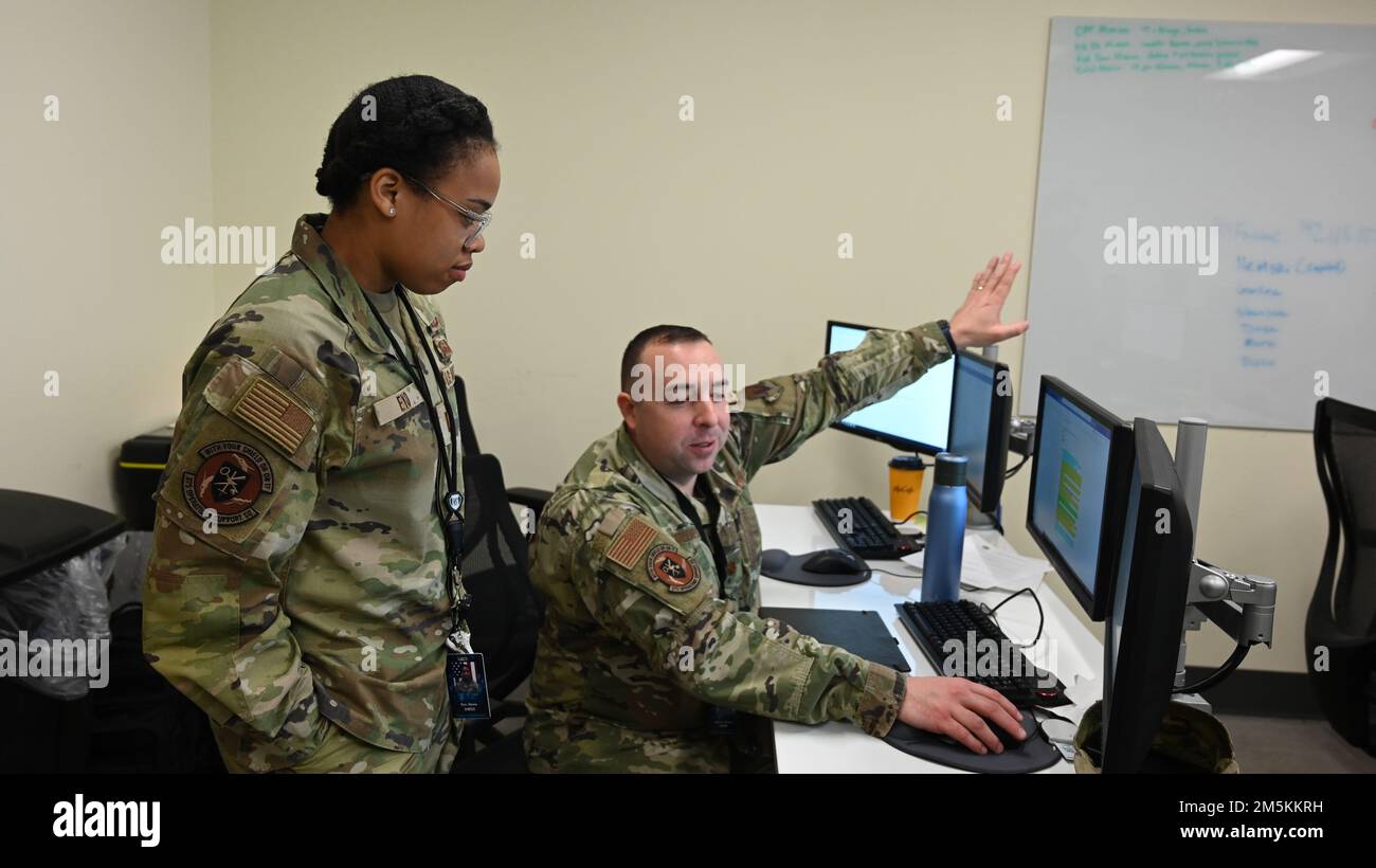 U.S. Air Force 1st Lt. Alexis Eyo (left), cyber officer assigned to the ...