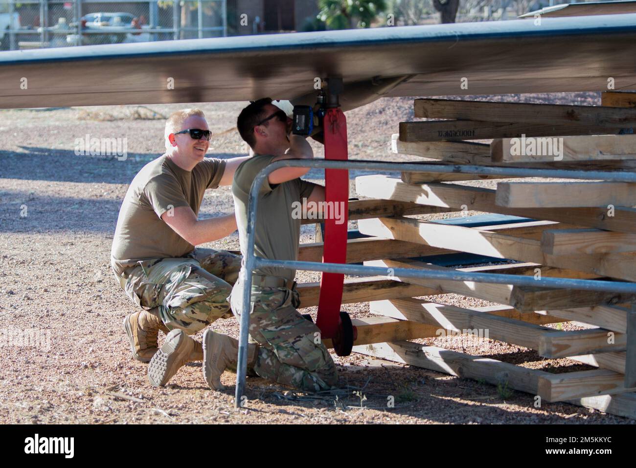 Two U.S. Air Force Airmen assigned to the 309th Aircraft Battle Damage ...