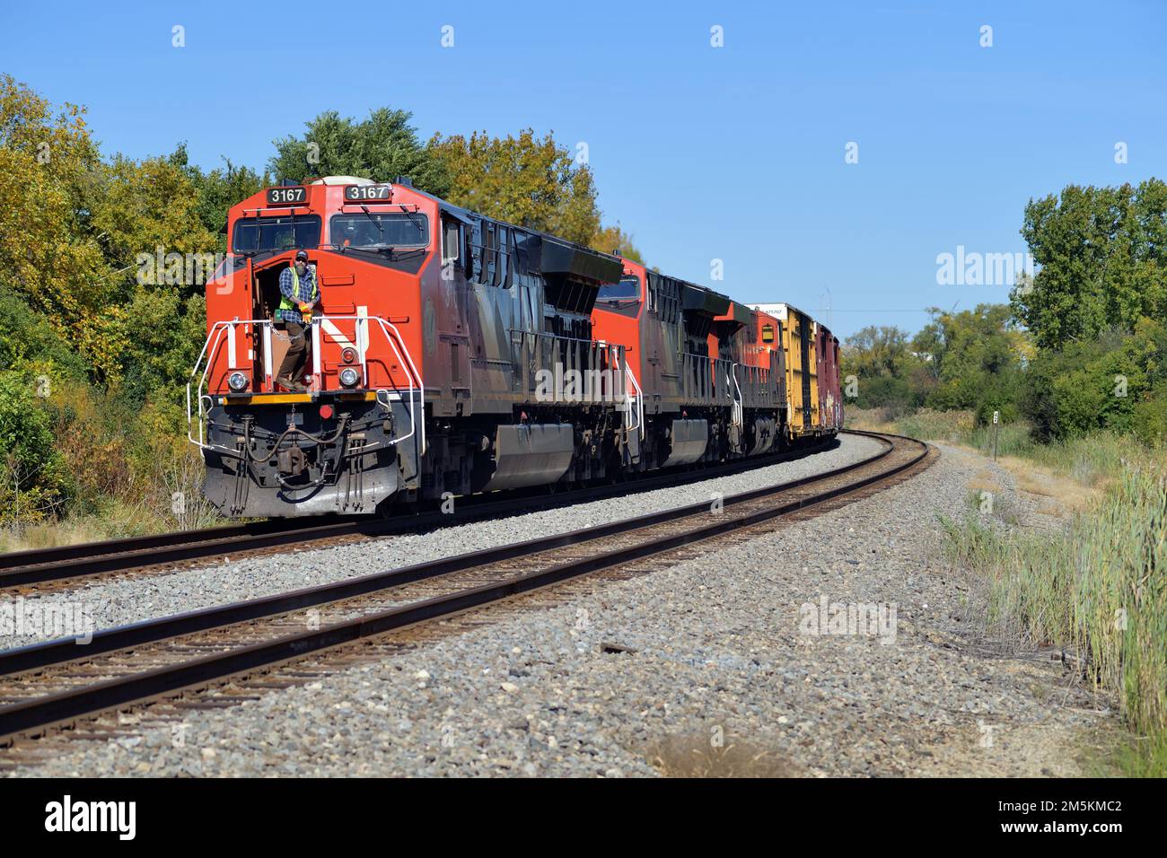 Hoffman Estates, Illinois, USA. A conductor leaving the lead locomotive ...