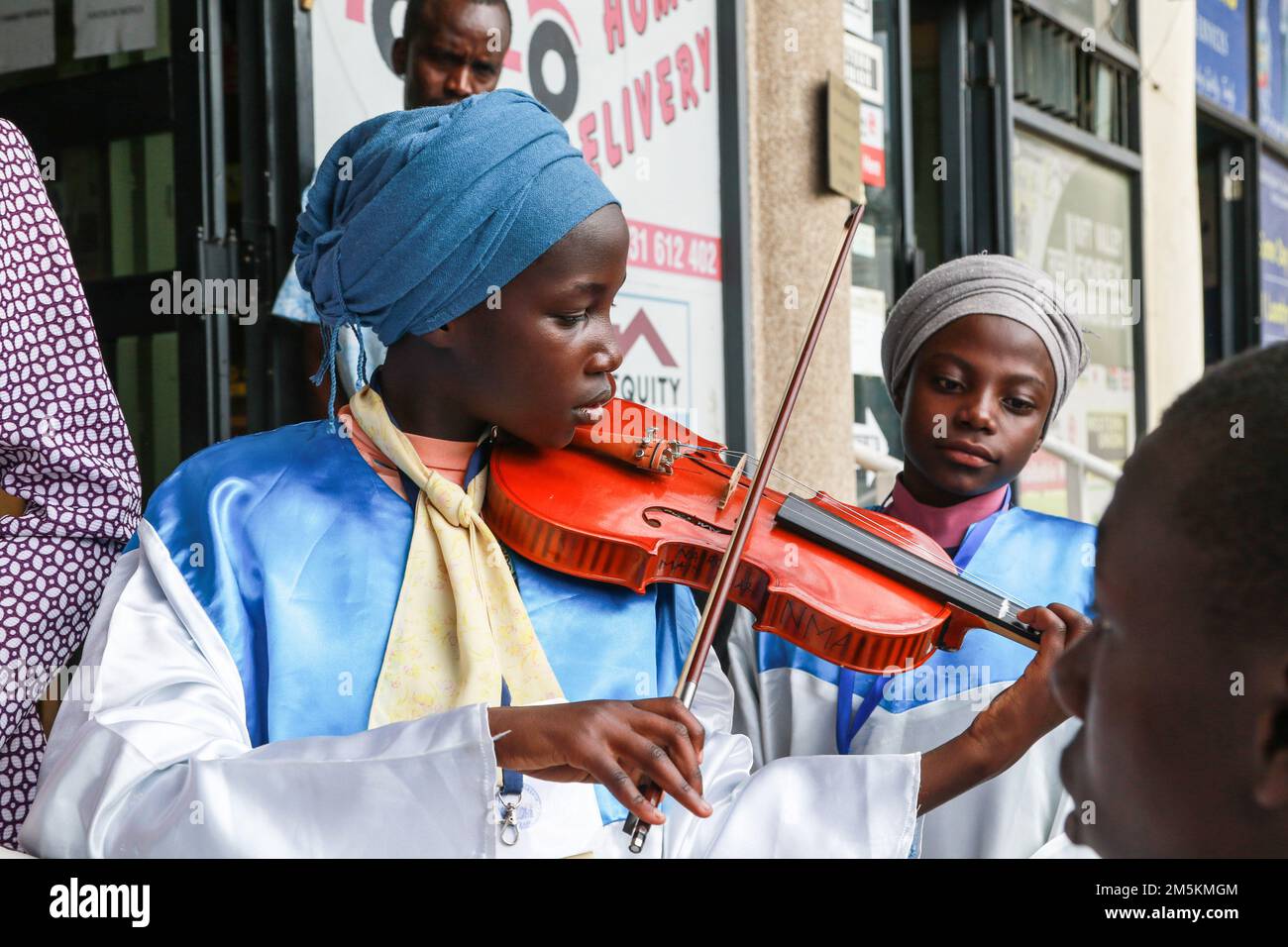 Nakuru, Kenya. 29th Dec, 2022. A worshipper plays violin during a ...