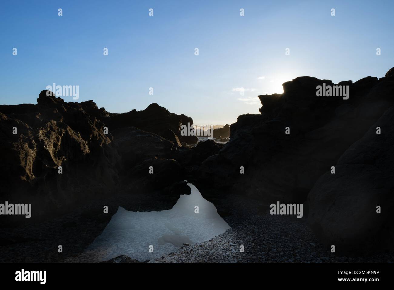 Mount Maunganui rocky silhouette landscape at sunrise from base of ...
