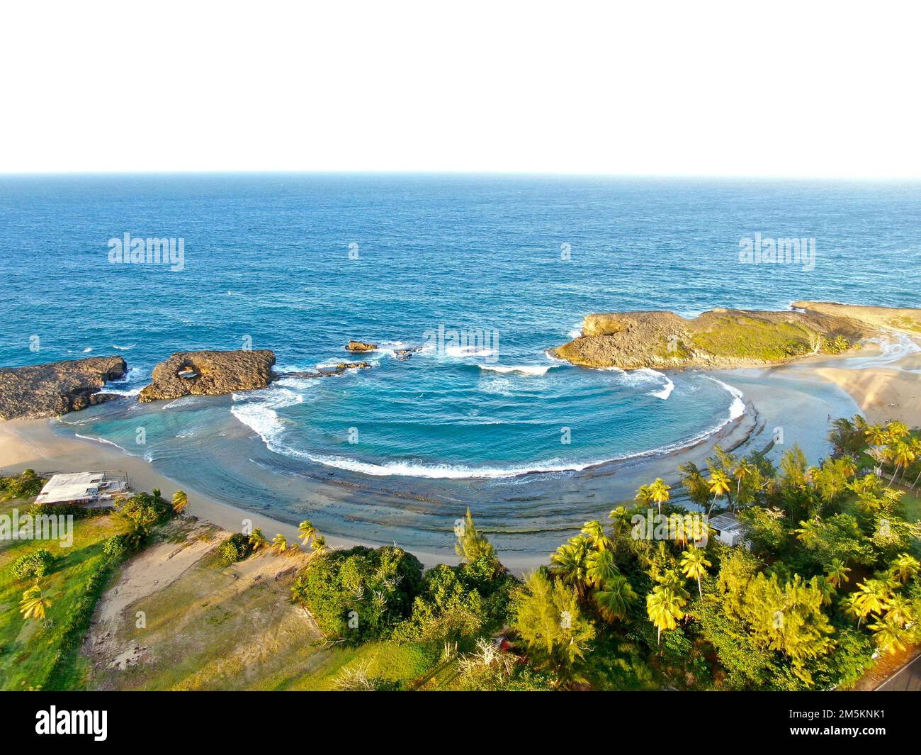 An aerial view of a beach with big rocks and waves Stock Photo - Alamy