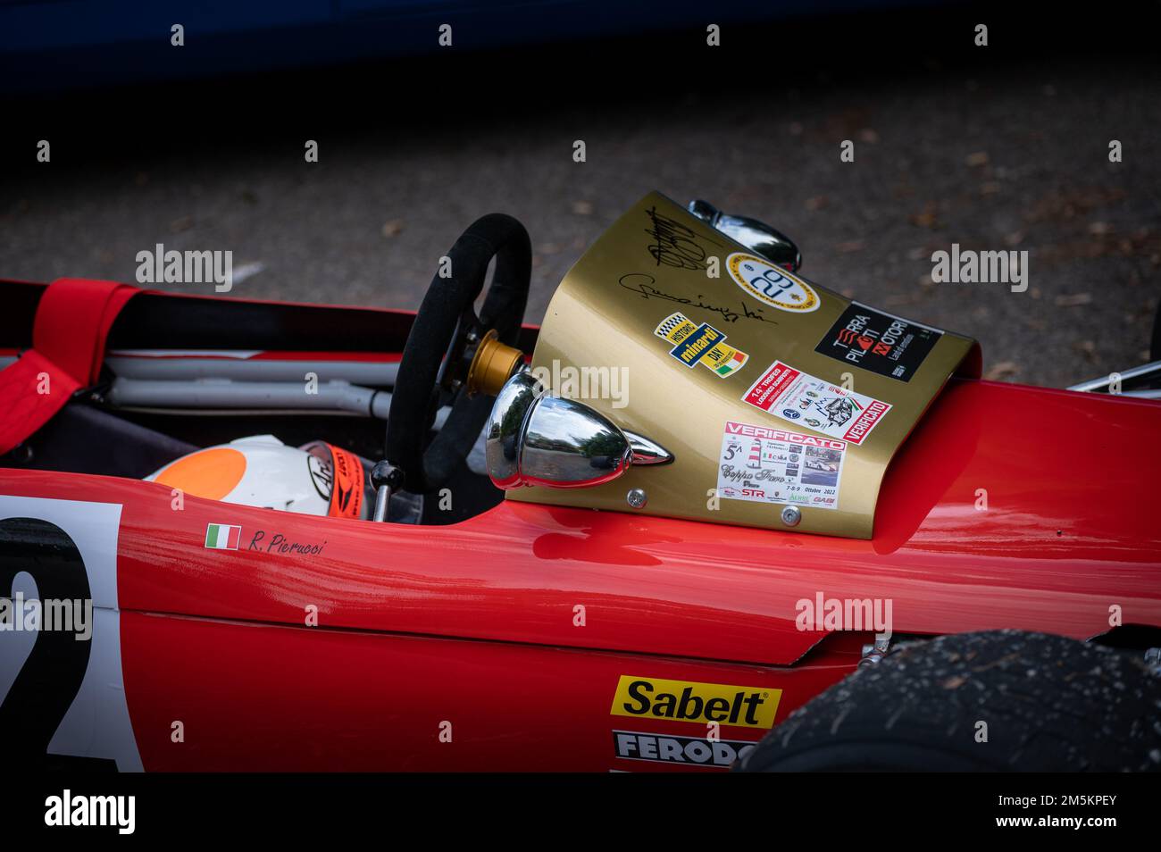 A closeup of the details of red car set up during an uphill speed race ...