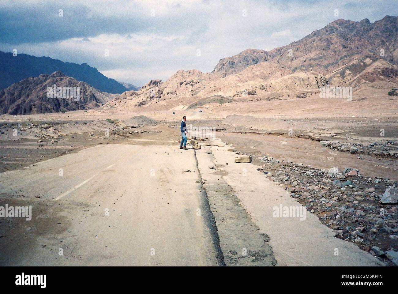 A road covered with mud after a flash-flood. Sinai Peninsula, Egypt ...