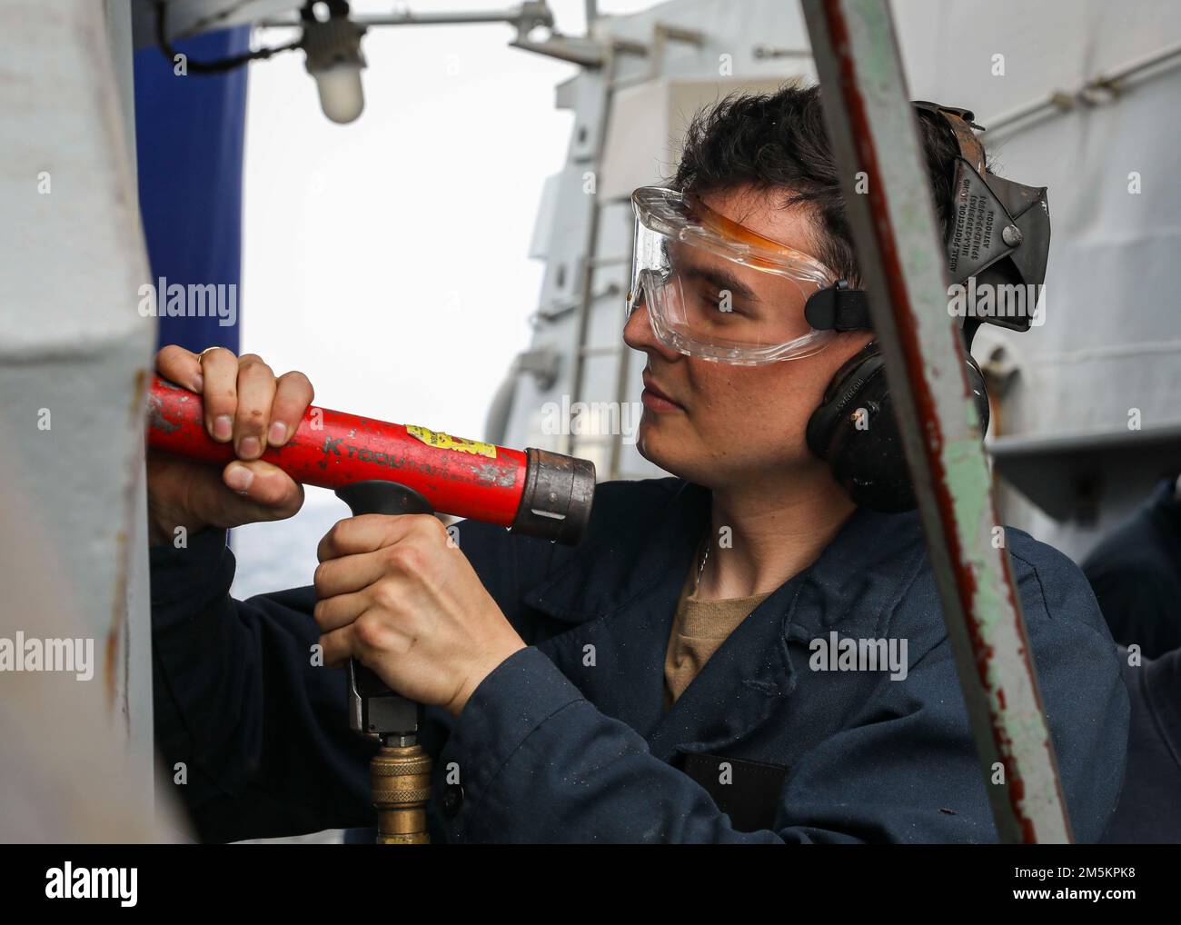 ATLANTIC OCEAN (March 23, 2022) – Seaman Giovanni Munoz uses a needle ...