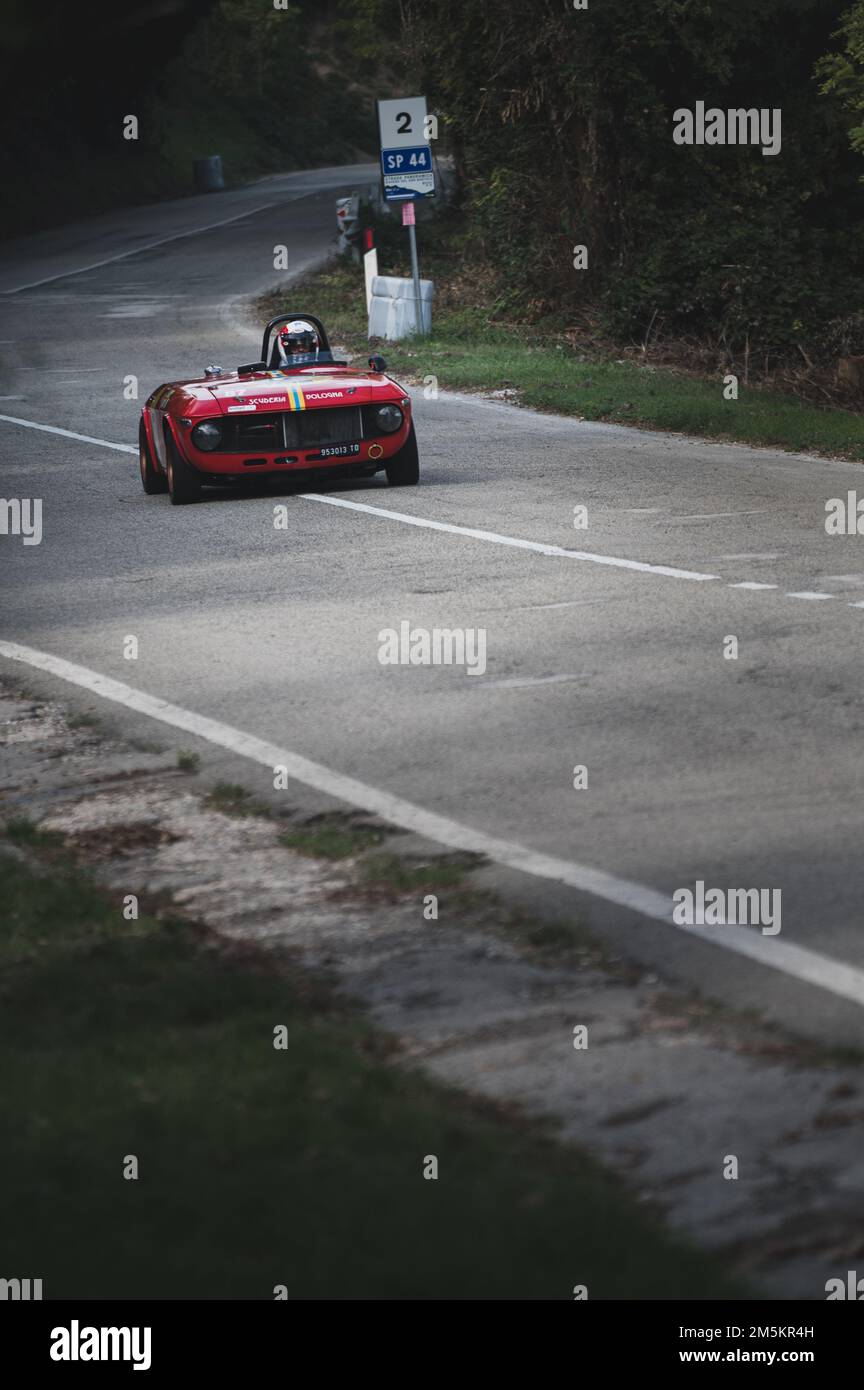 A red car set up during an uphill speed race of the Italian ...