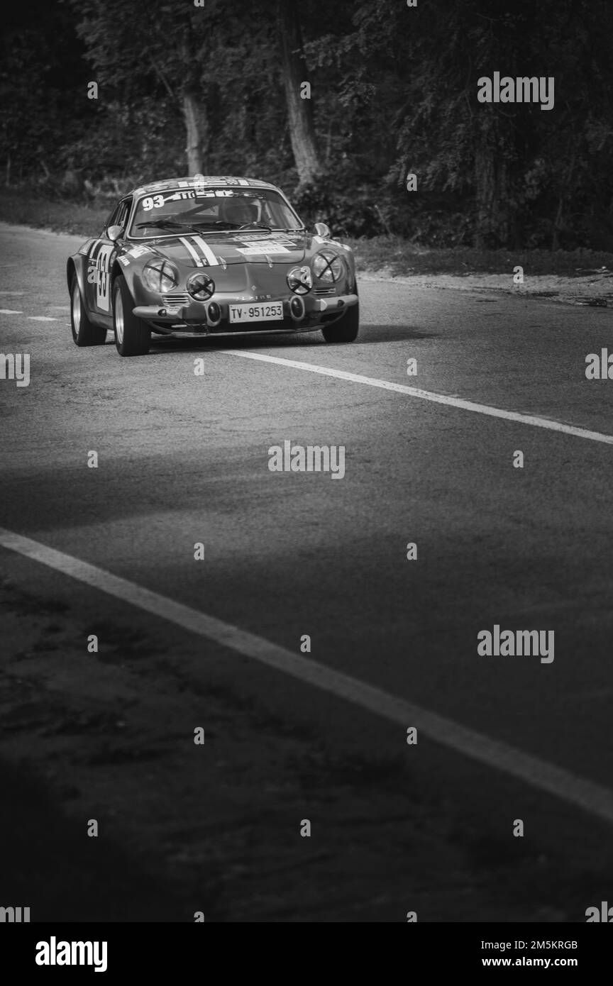 A greyscale of a car set up during an uphill speed race of the Italian ...
