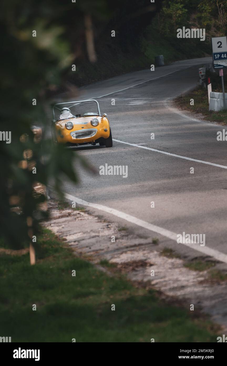 A yellow car set up during an uphill speed race of the Italian ...