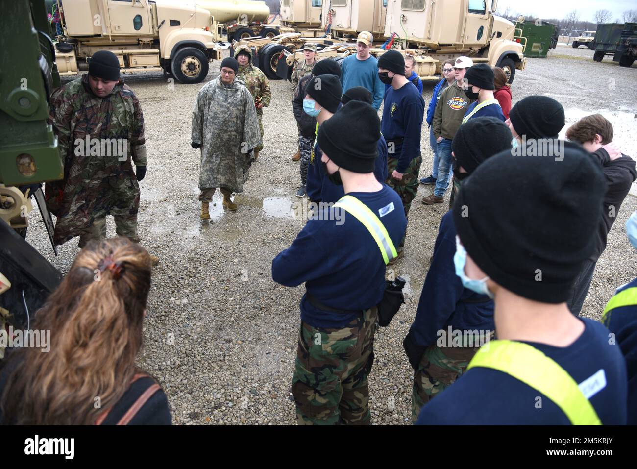 Michigan National Guard Soldiers discuss a military vehicle during a ...