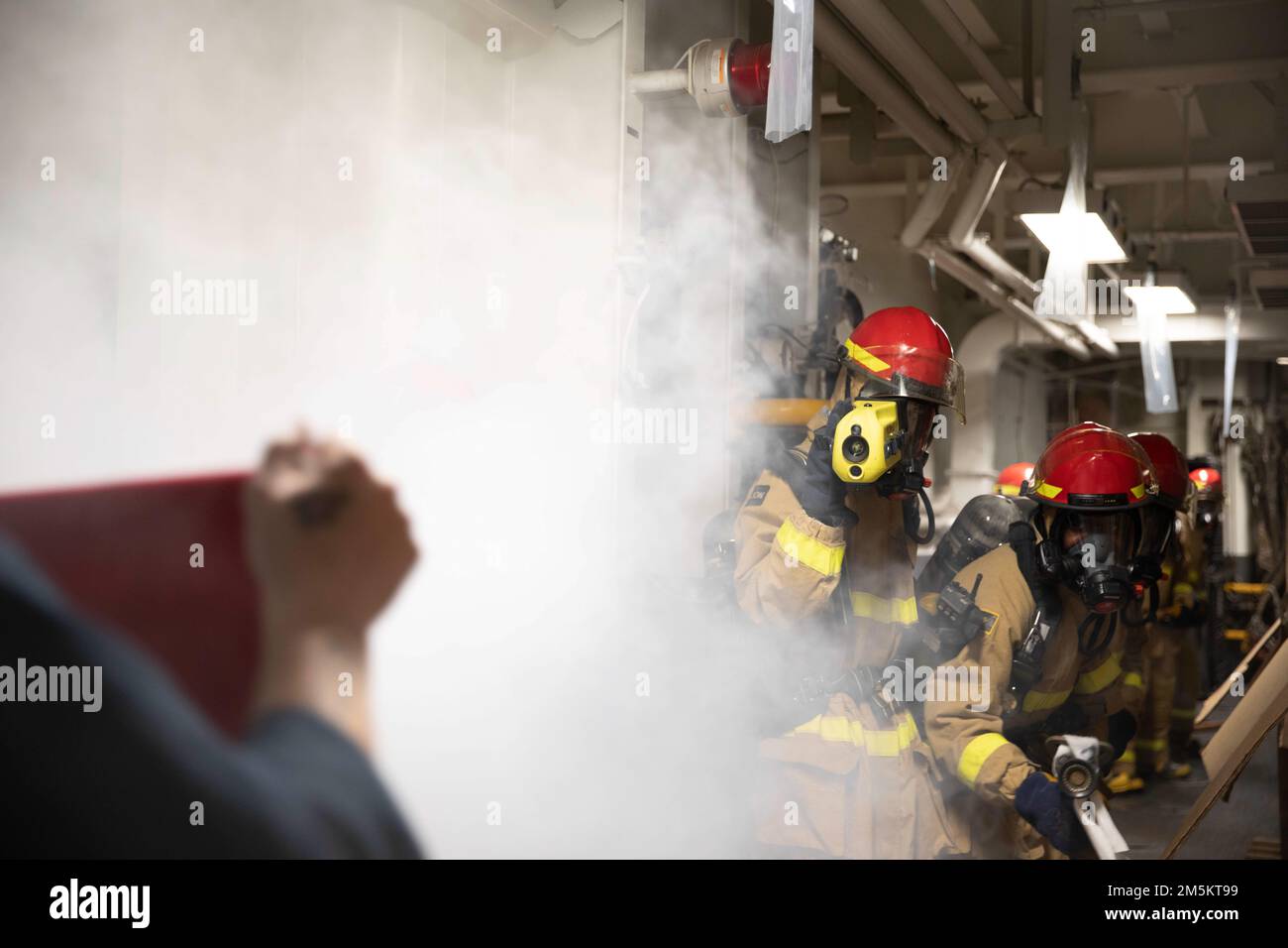 220323-N-VS068-1061 PACIFIC OCEAN (March 23, 2022) – Sailors combat a ...