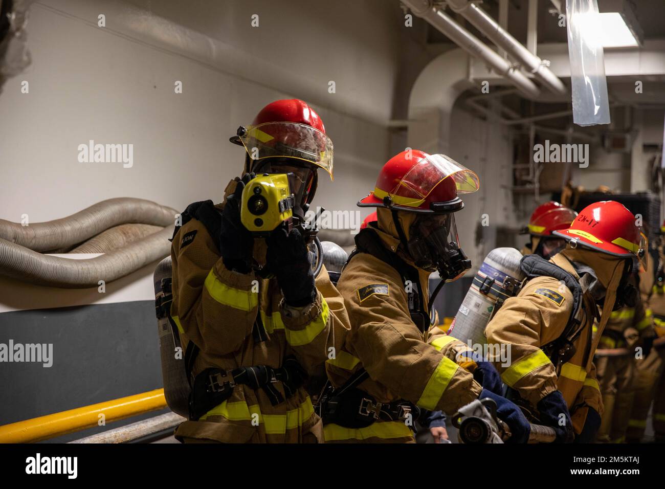 220323-N-VS068-1062 PACIFIC OCEAN (March 23, 2022) – Sailors combat a ...