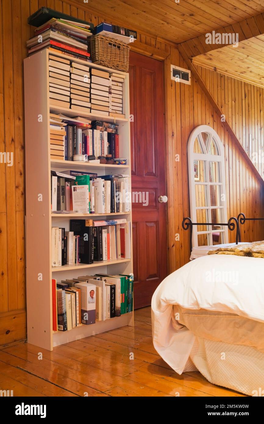 King size bed and bookcase in guest bedroom on upstairs floor inside ...