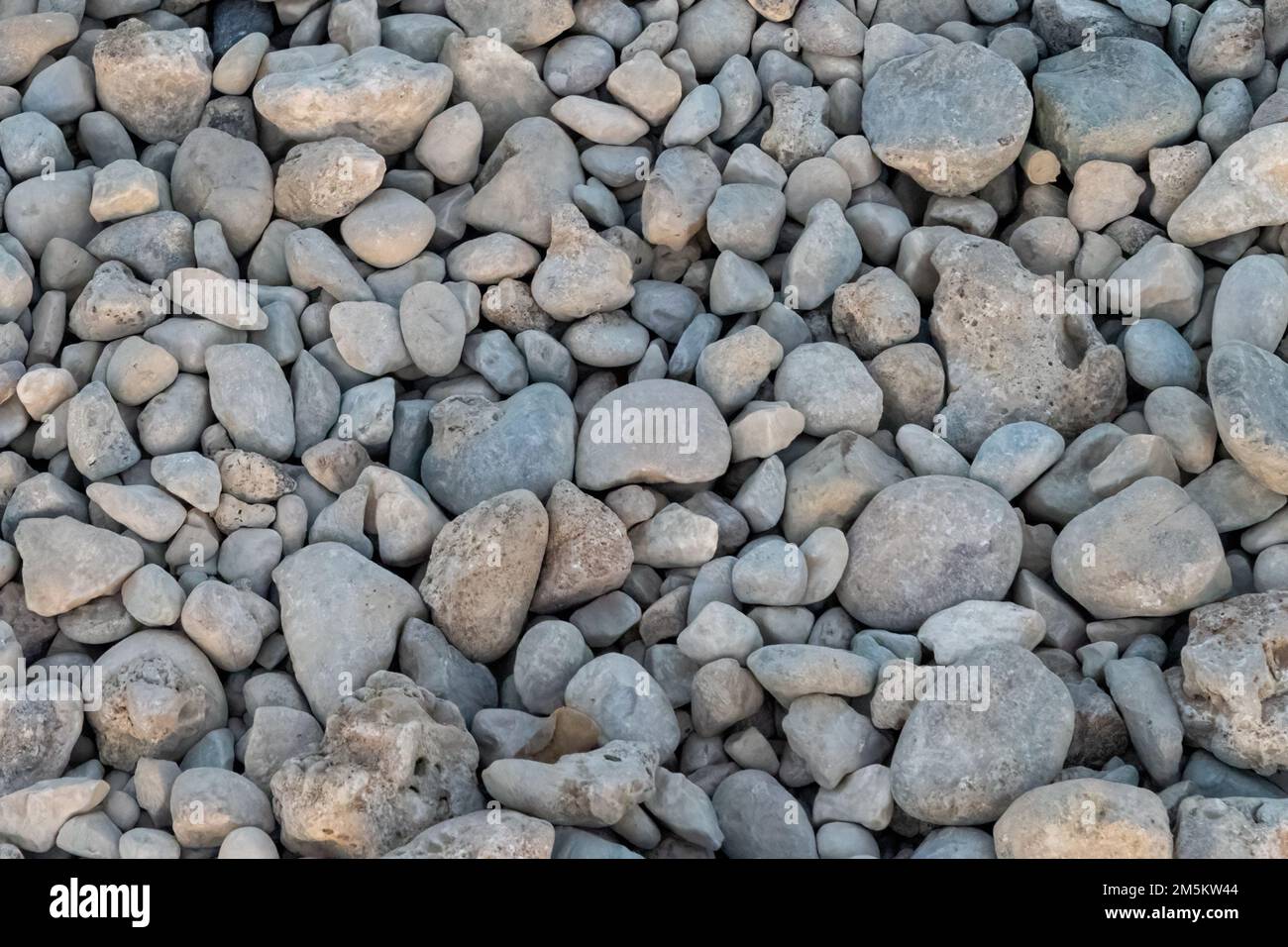 A top view closeup shot of a group of rocks on the beach Stock Photo ...