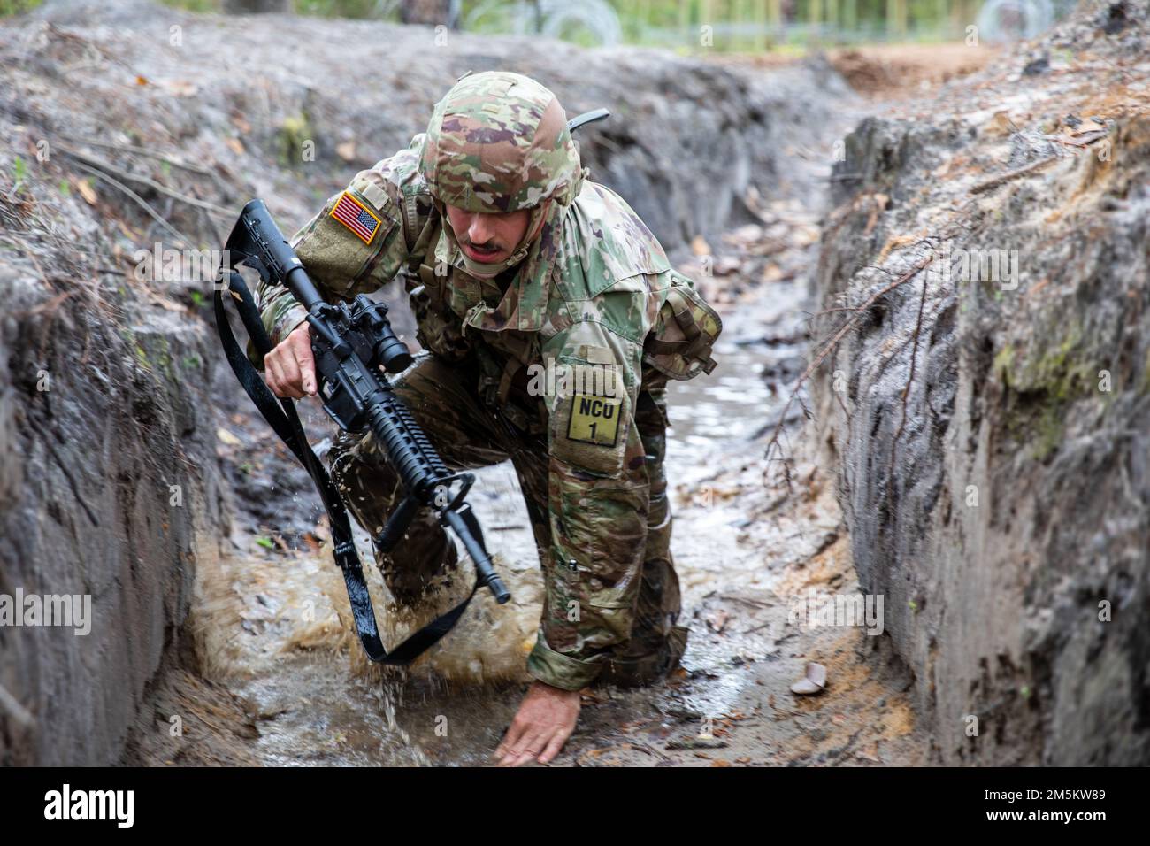 U.S Army Sgt. Matthew Fiore, a UH-60 Black Hawk crew chief representing ...