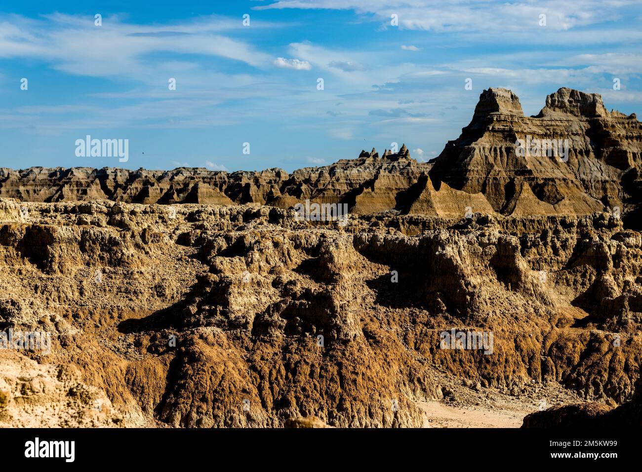 Dry Rocky Landscape of badlands National Park Along the Blue Sky Stock ...