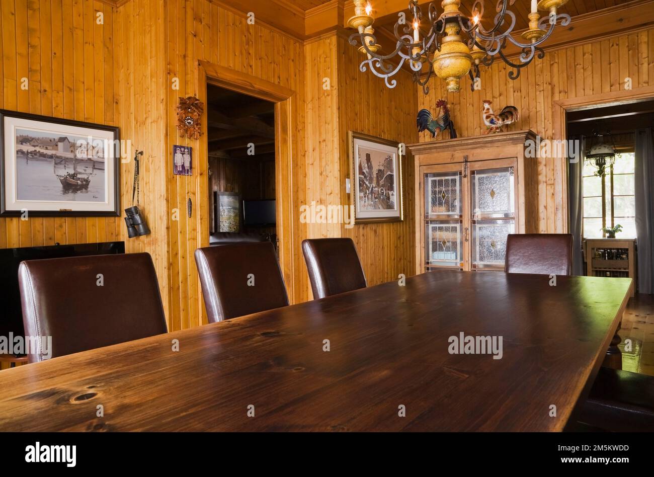 Long dining table and chairs in dining room inside old 1920s cottage ...