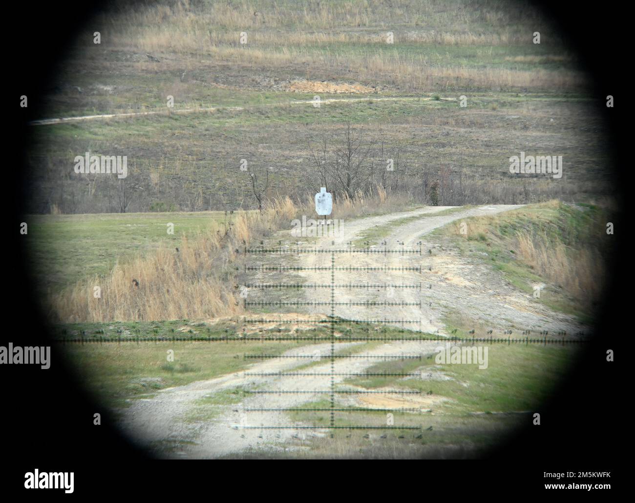 A target as seen through a spotting scope of an instructor from the ...