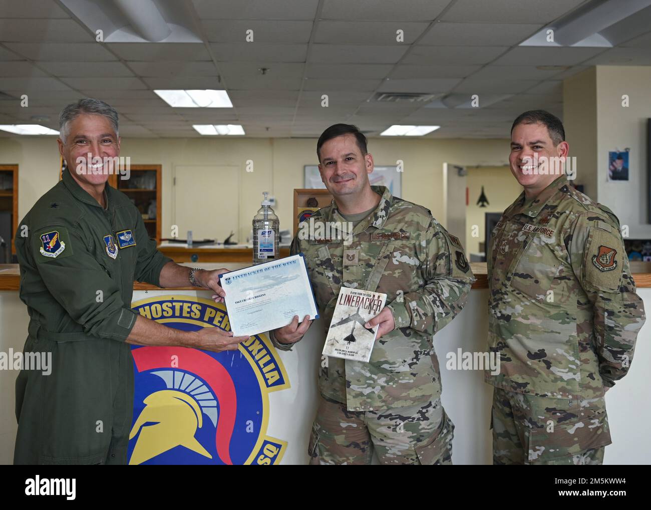 U.S. Air Force Brig. Gen. Jeremy Sloane, 36th Wing commander, presents ...