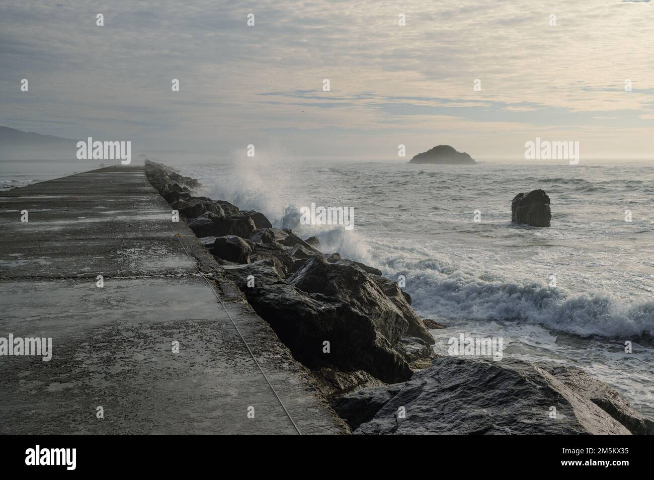Big ocean wave hit in a jetty on a stormy day Stock Photo - Alamy